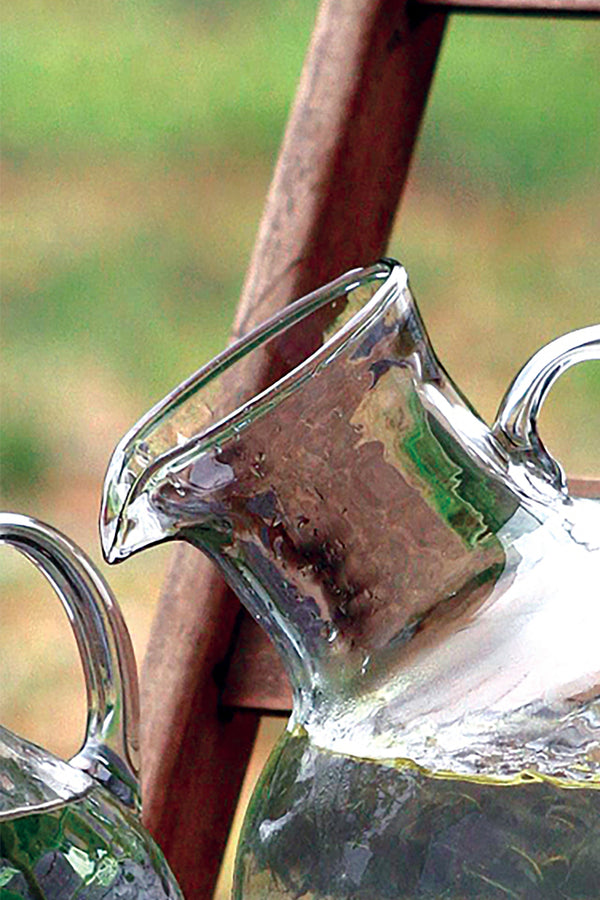 Modern Circular Tilted Glass Beverage Pitcher - Woodwaves