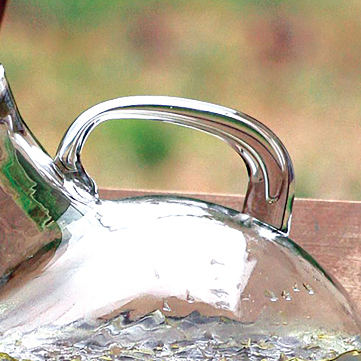 Modern Circular Tilted Glass Beverage Pitcher - Woodwaves