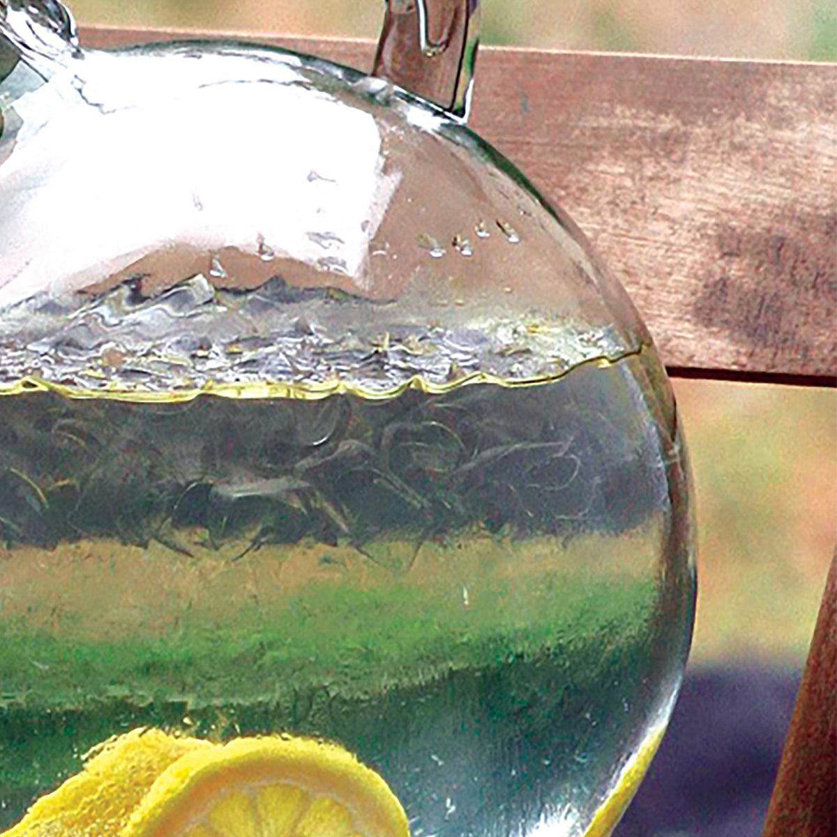 Modern Circular Tilted Glass Beverage Pitcher - Woodwaves